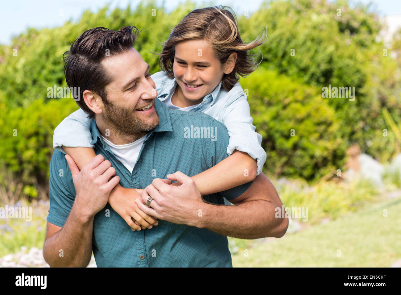 Father and son smiling at each other Stock Photo - Alamy