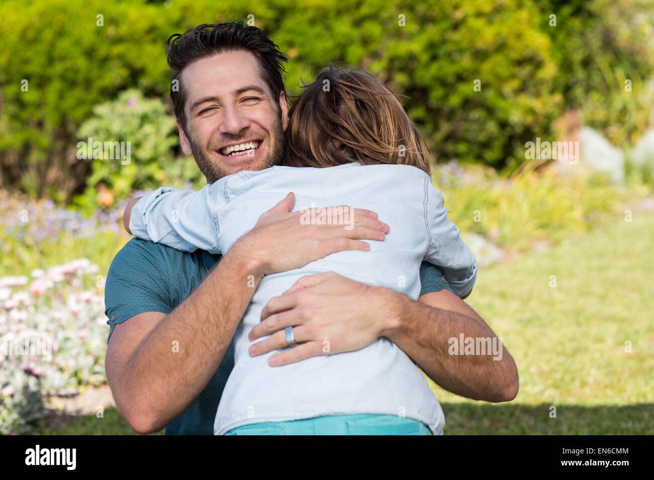Father and son hugging Stock Photo - Alamy