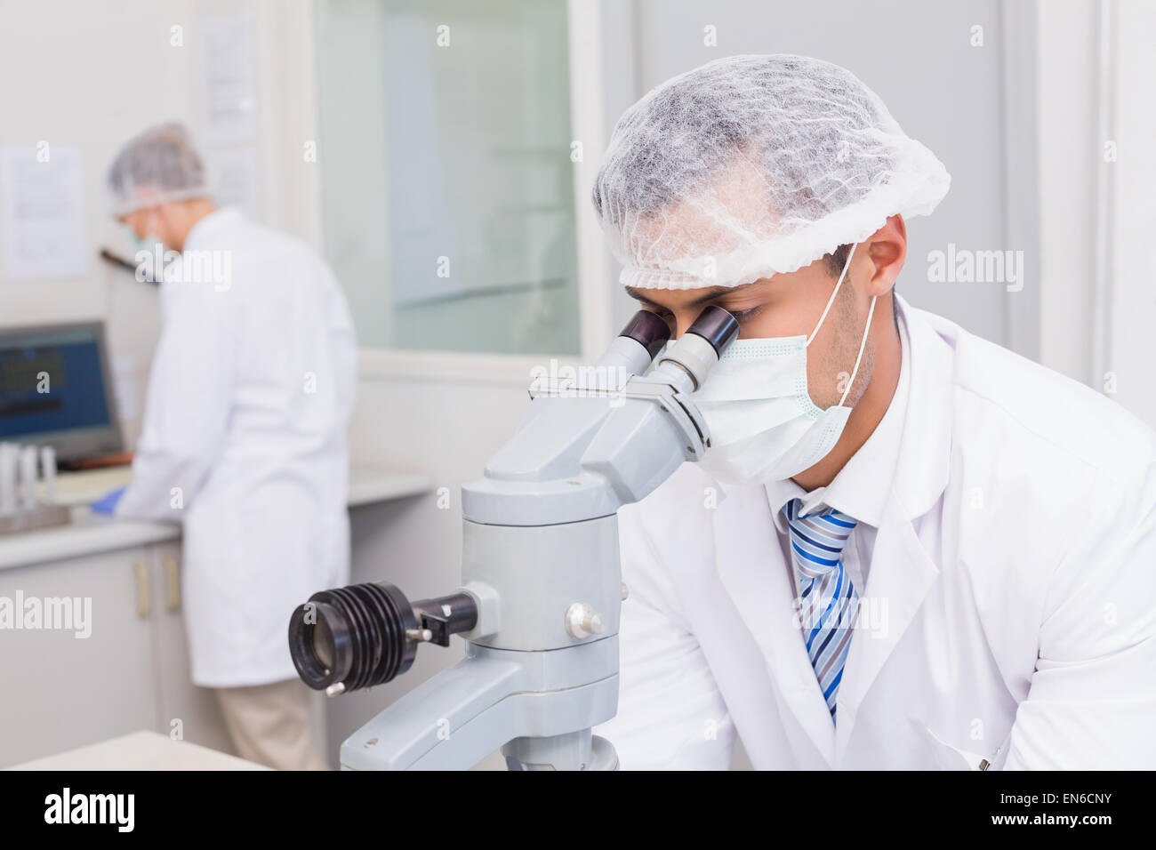 Scientists using microscope Stock Photo - Alamy Scientists using microscope Stock Photo - Alamy