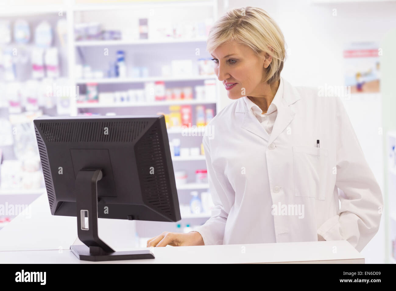 Pharmacist using the computer Stock Photo - Alamy