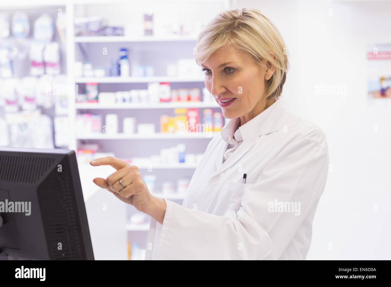 Focused pharmacist using the computer Stock Photo - Alamy