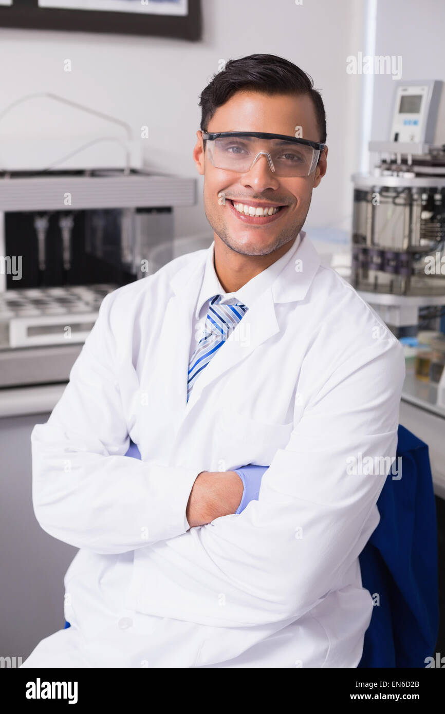 Happy scientist smiling at camera with arms crossed Stock Photo - Alamy
