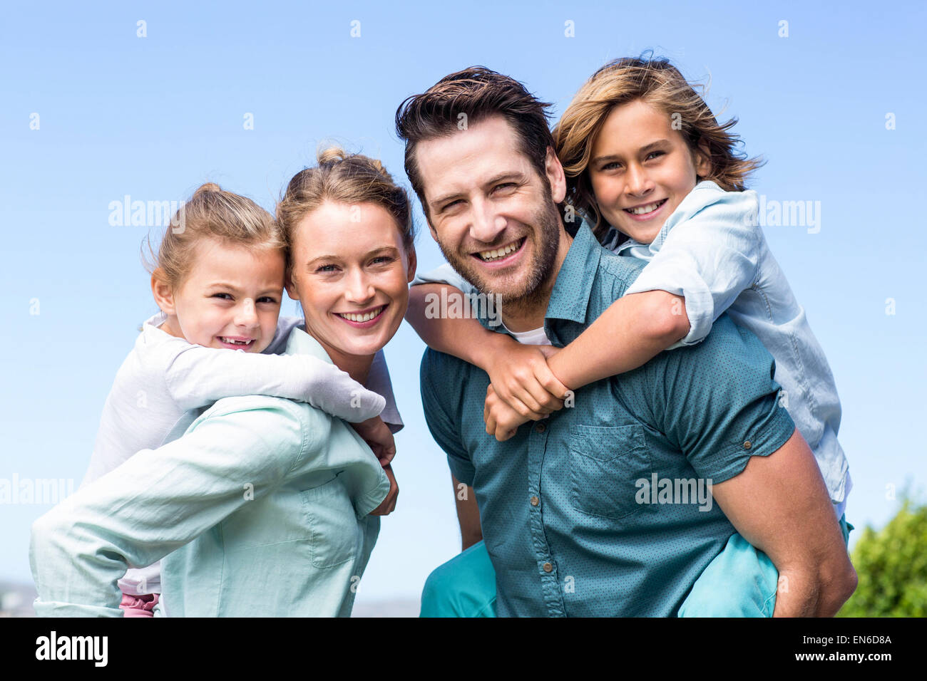 Happy parents with their children Stock Photo - Alamy