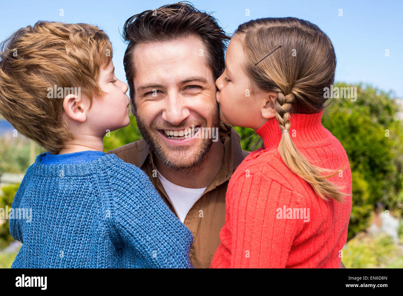 Happy father smiling at camera Stock Photo - Alamy