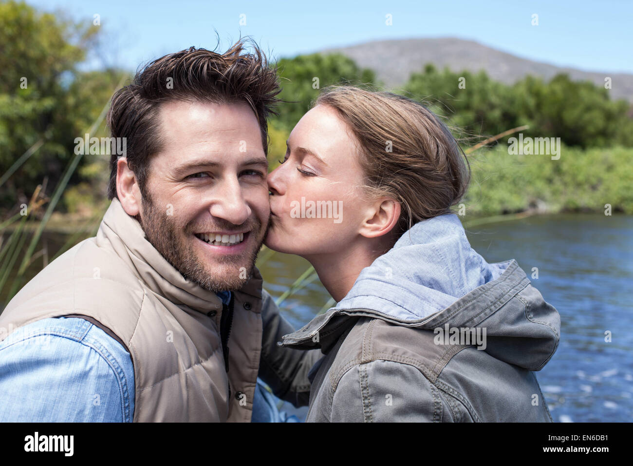 Portrait couple sitting lake hi-res stock photography and images - Alamy