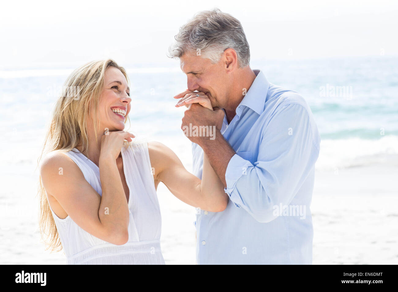 Happy couple laughing together Stock Photo - Alamy