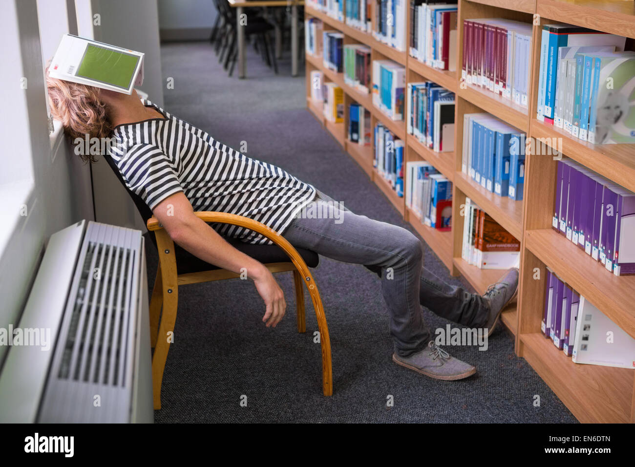 Student sleeping in library hi-res stock photography and images - Alamy