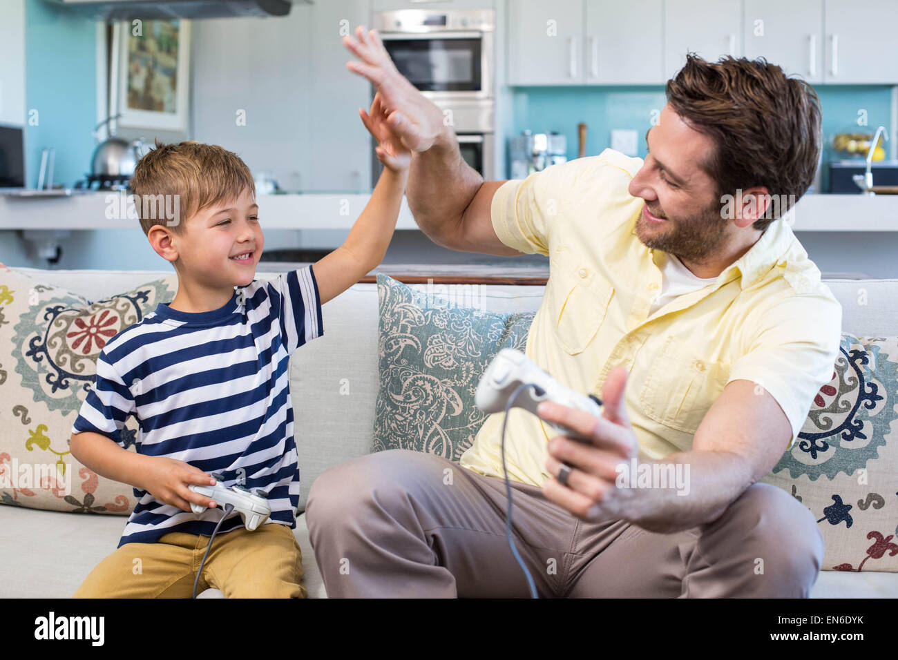 Playing video games high five hi-res stock photography and images - Alamy