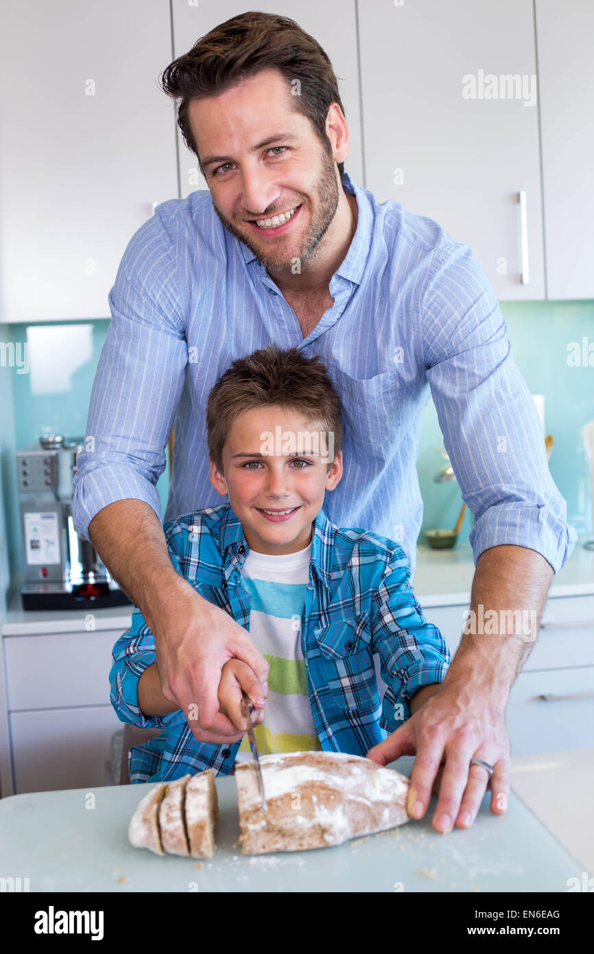 Happy family preparing lunch together Stock Photo - Alamy