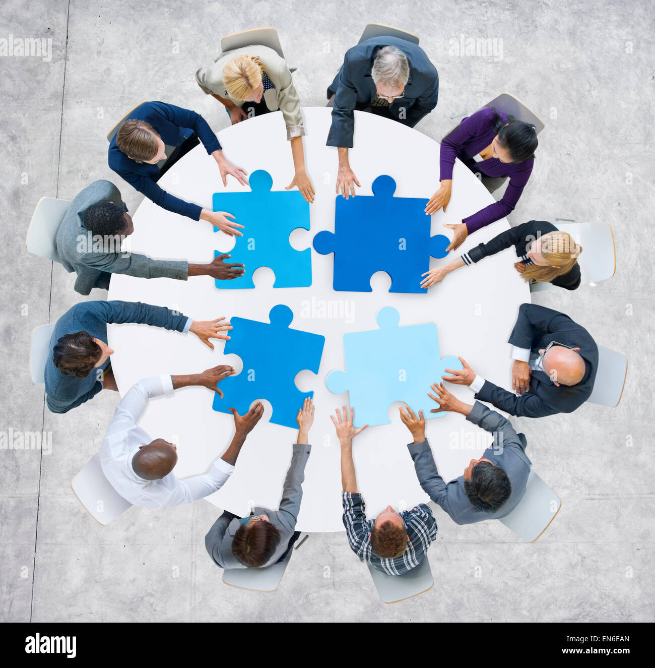 Business team building puzzle pieces hi-res stock photography and ...