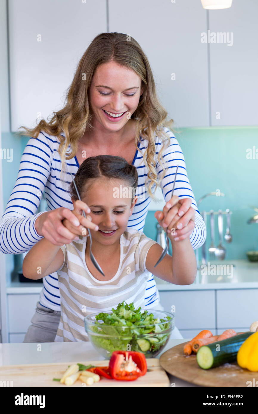 Happy family preparing lunch together Stock Photo - Alamy