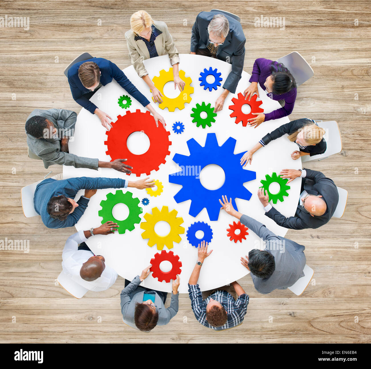 Group of Diverse Business People in a Meeting with Gears Stock Photo ...