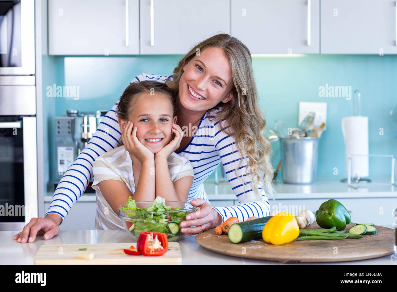 Happy family preparing lunch together Stock Photo - Alamy