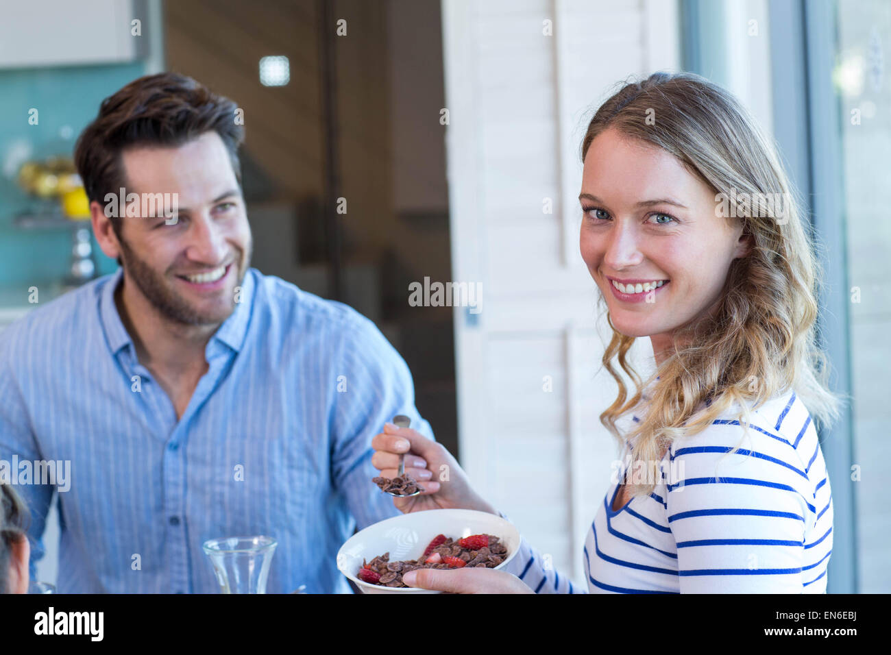 Happy couple having breakfast together Stock Photo - Alamy