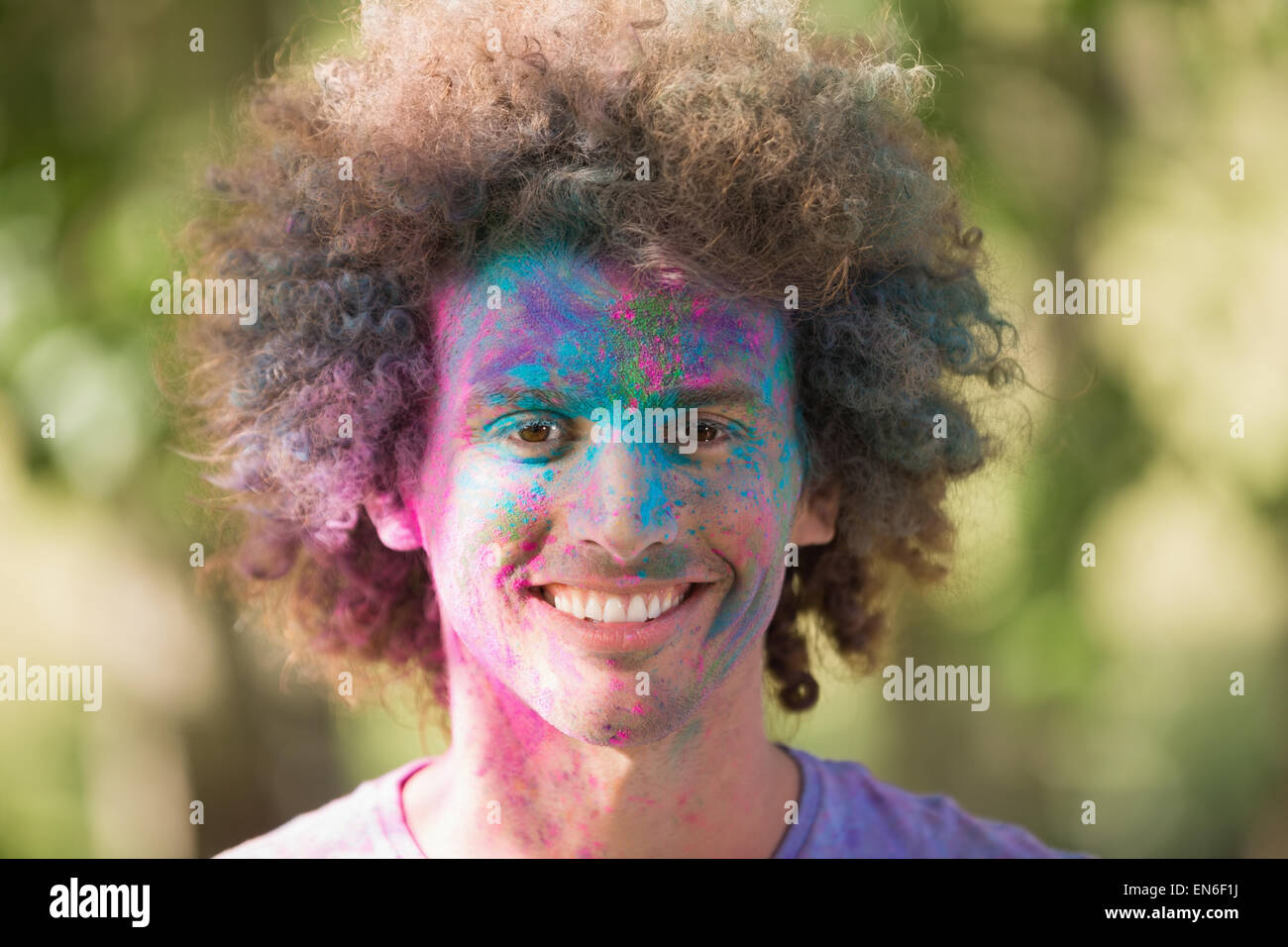 Young man covered in powder paint Stock Photo - Alamy