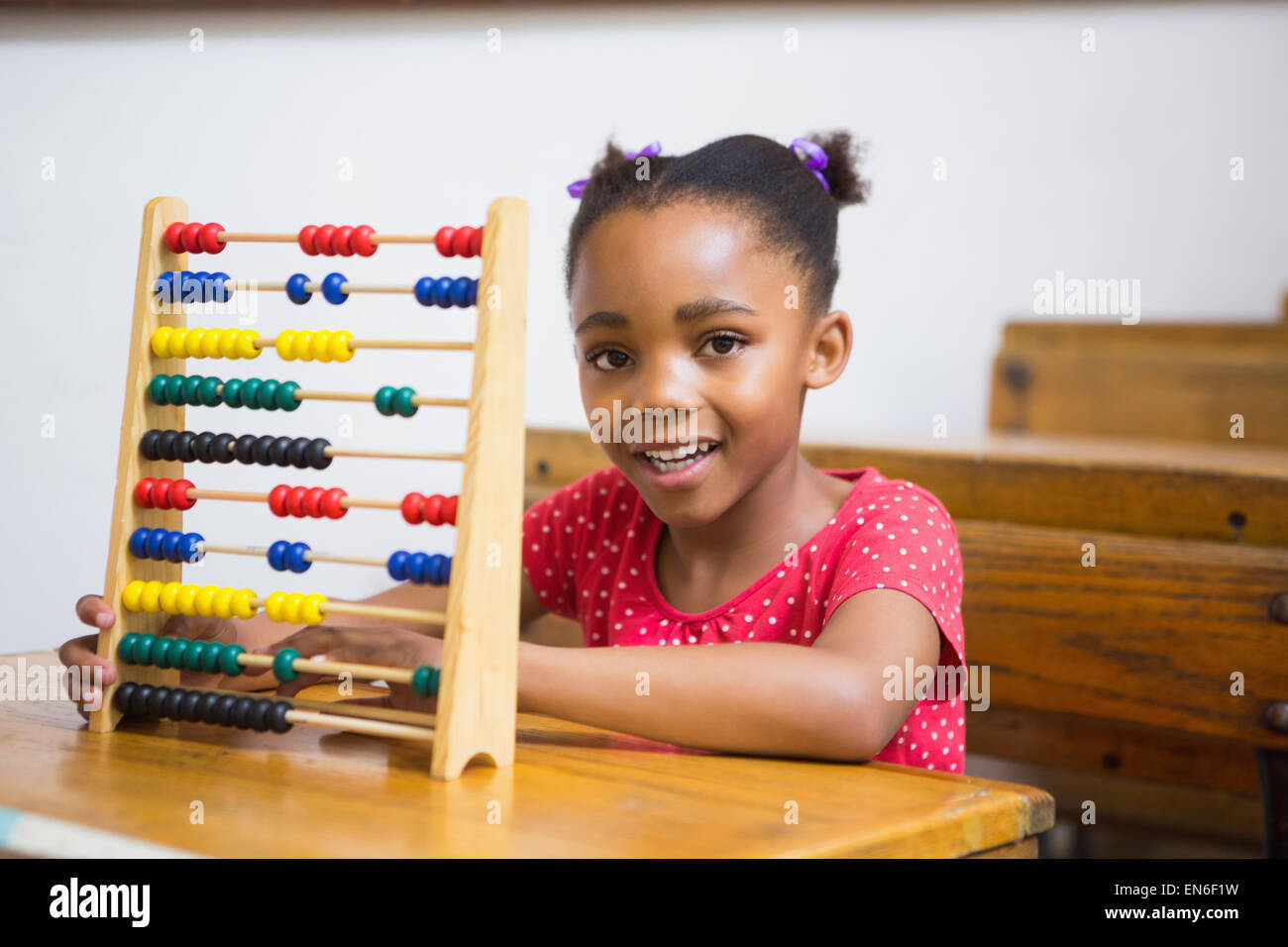 Smiling pupil using abacus in classroom Stock Photo - Alamy Smiling pupil using abacus in classroom Stock Photo - Alamy