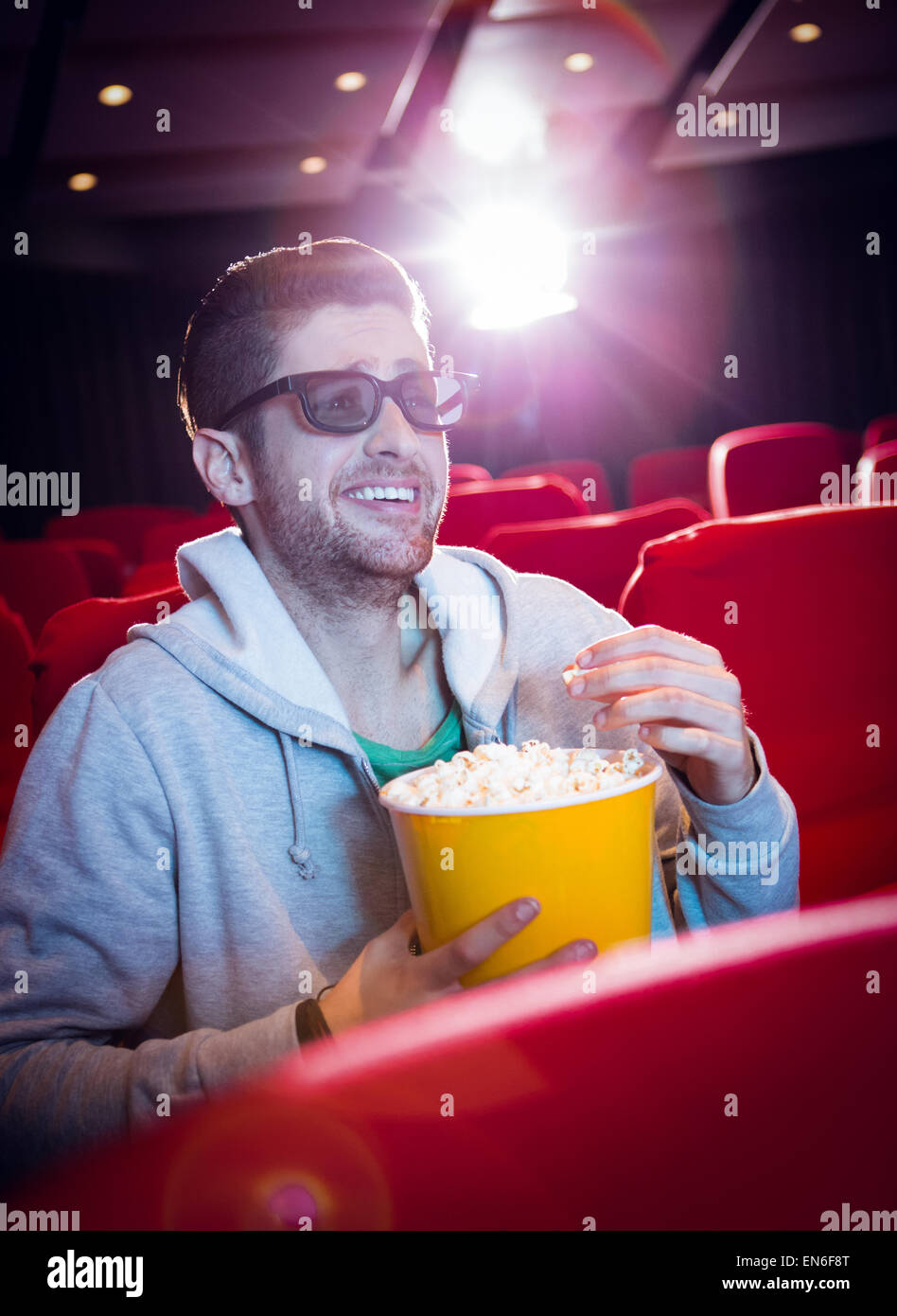 Young man watching a 3d film Stock Photo - Alamy