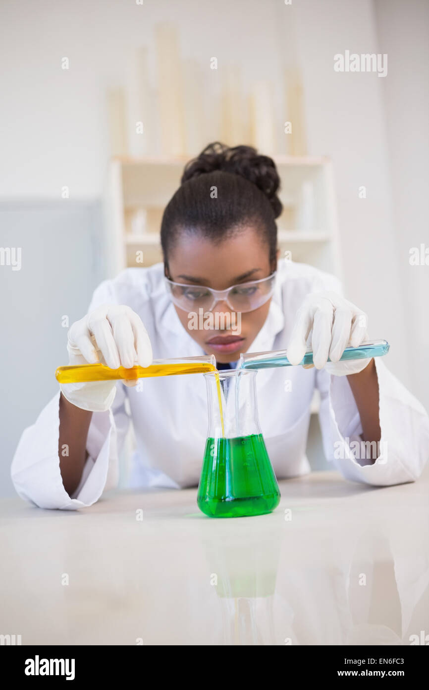 Concentrated scientist doing scientific experiment Stock Photo - Alamy