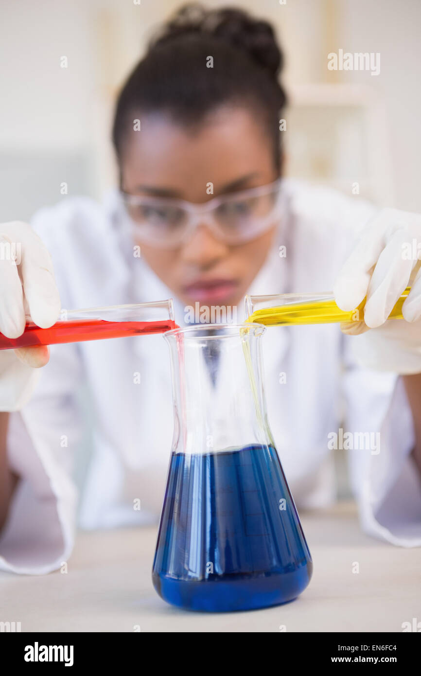 Concentrated scientist doing scientific experiment Stock Photo - Alamy