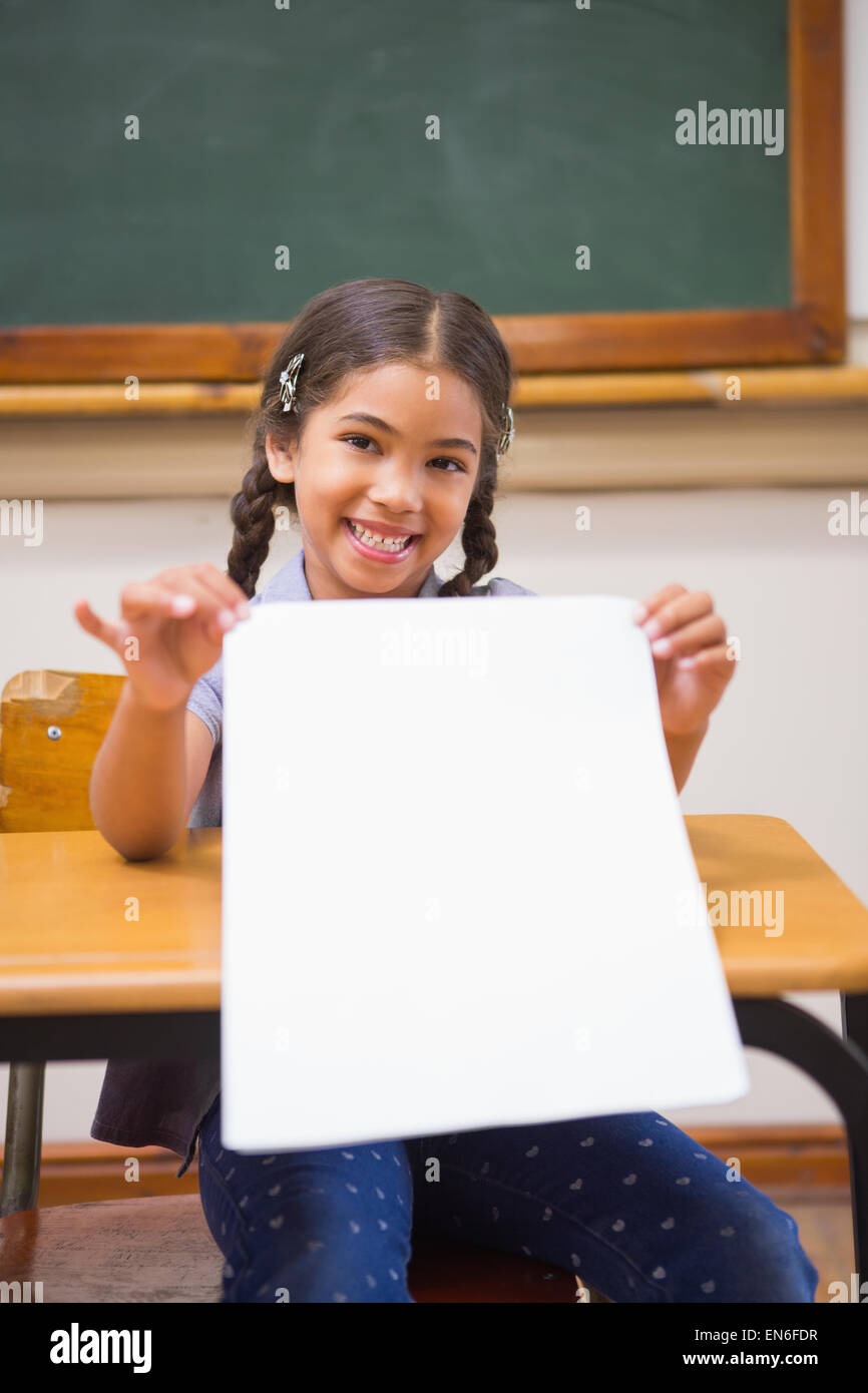Smiling pupil showing paper Stock Photo - Alamy