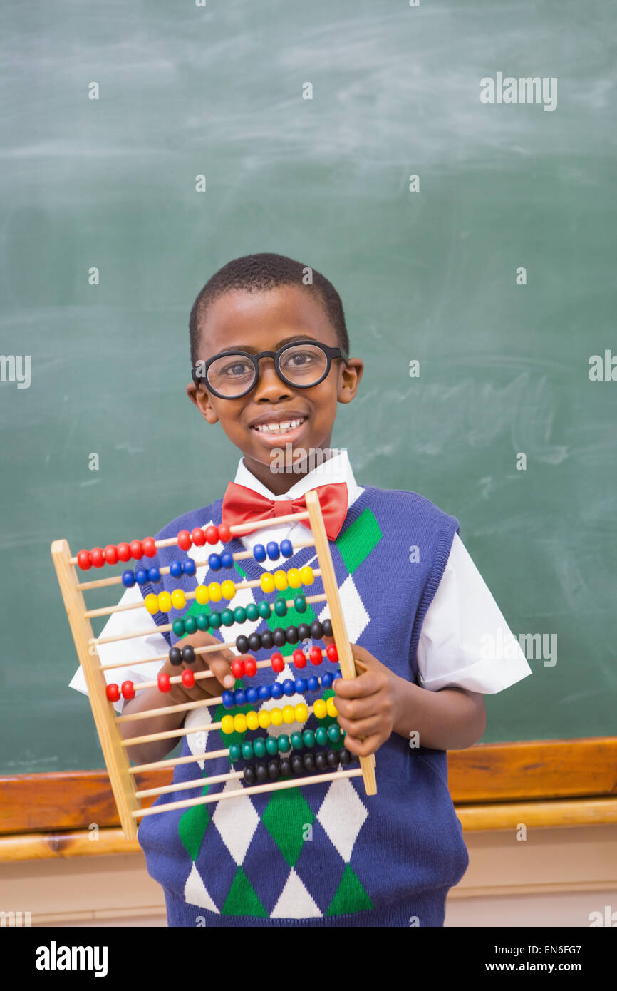 Smiling pupil holding abacus Stock Photo - Alamy