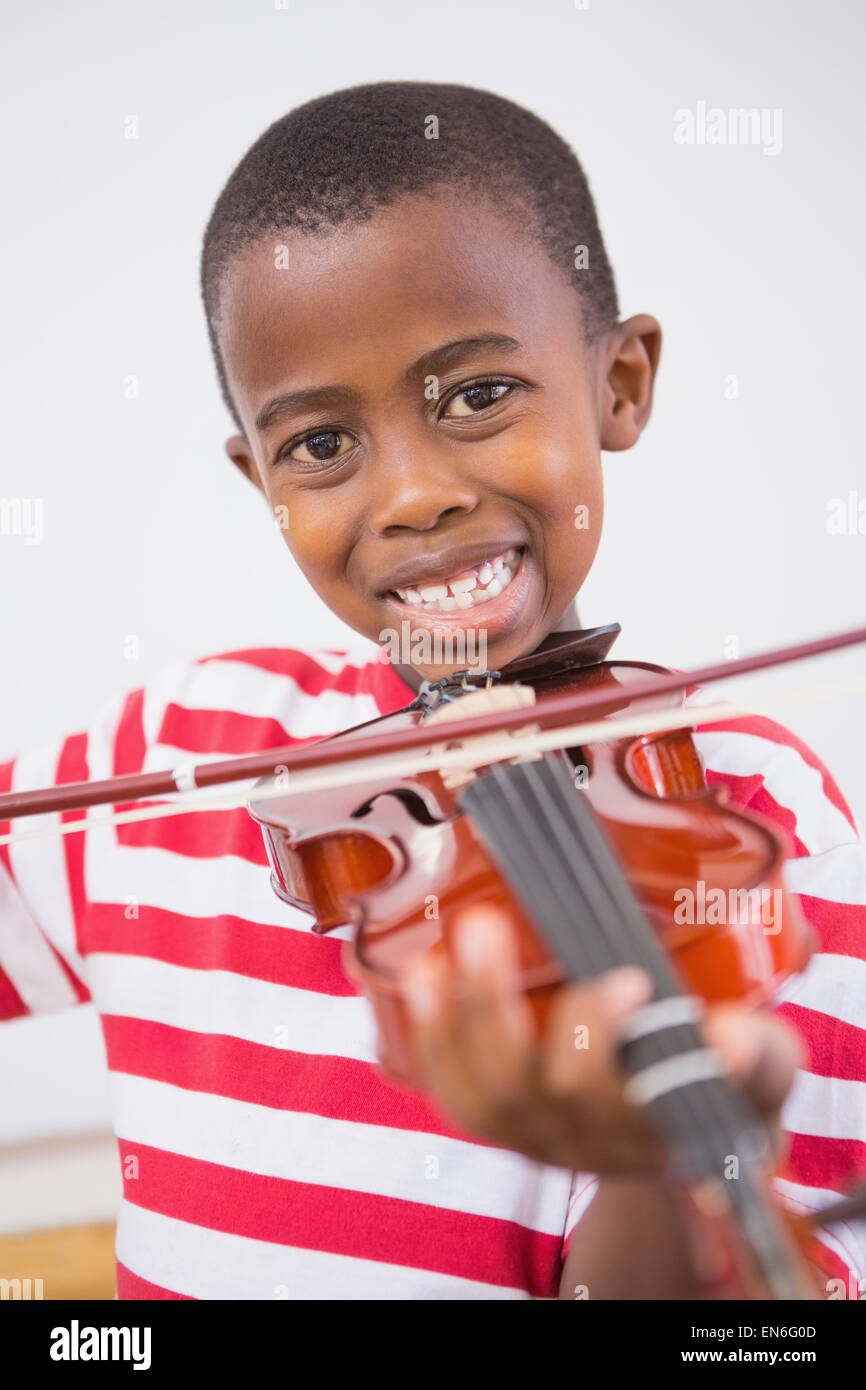 Happy pupil playing violin in classroom Stock Photo - Alamy