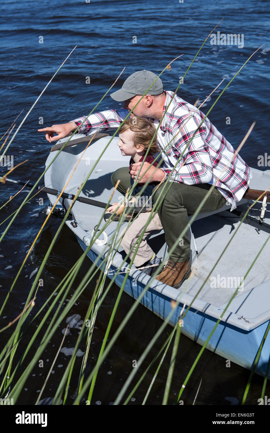 Happy man fishing with his son Stock Photo - Alamy