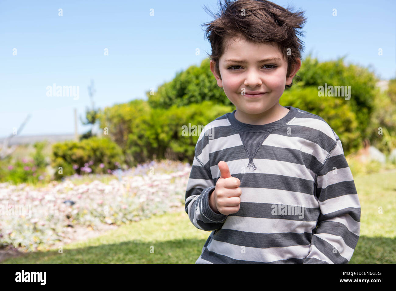Cute boy smiling at camera Stock Photo - Alamy