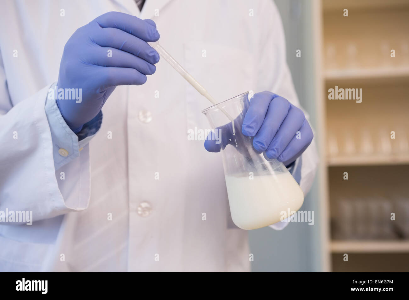 Scientist examining white liquid Stock Photo - Alamy Scientist examining white liquid Stock Photo - Alamy
