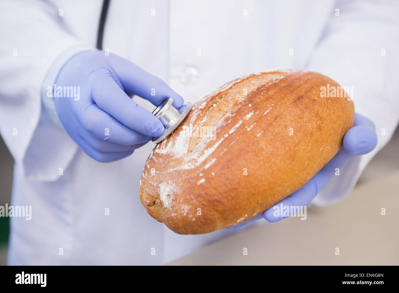 Scientist listening to bread Stock Photo - Alamy