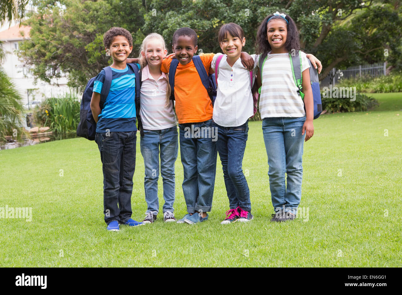 Happy friends playing in the park Stock Photo - Alamy