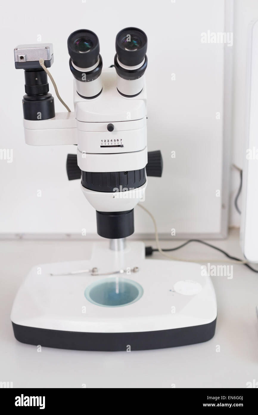 Microscope on a desk Stock Photo - Alamy