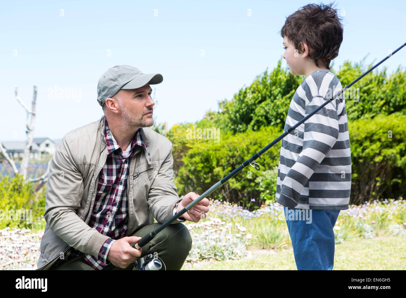 Father and son fishing together Stock Photo - Alamy