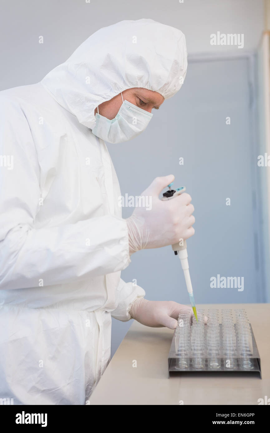 Scientist injecting tubes Stock Photo - Alamy