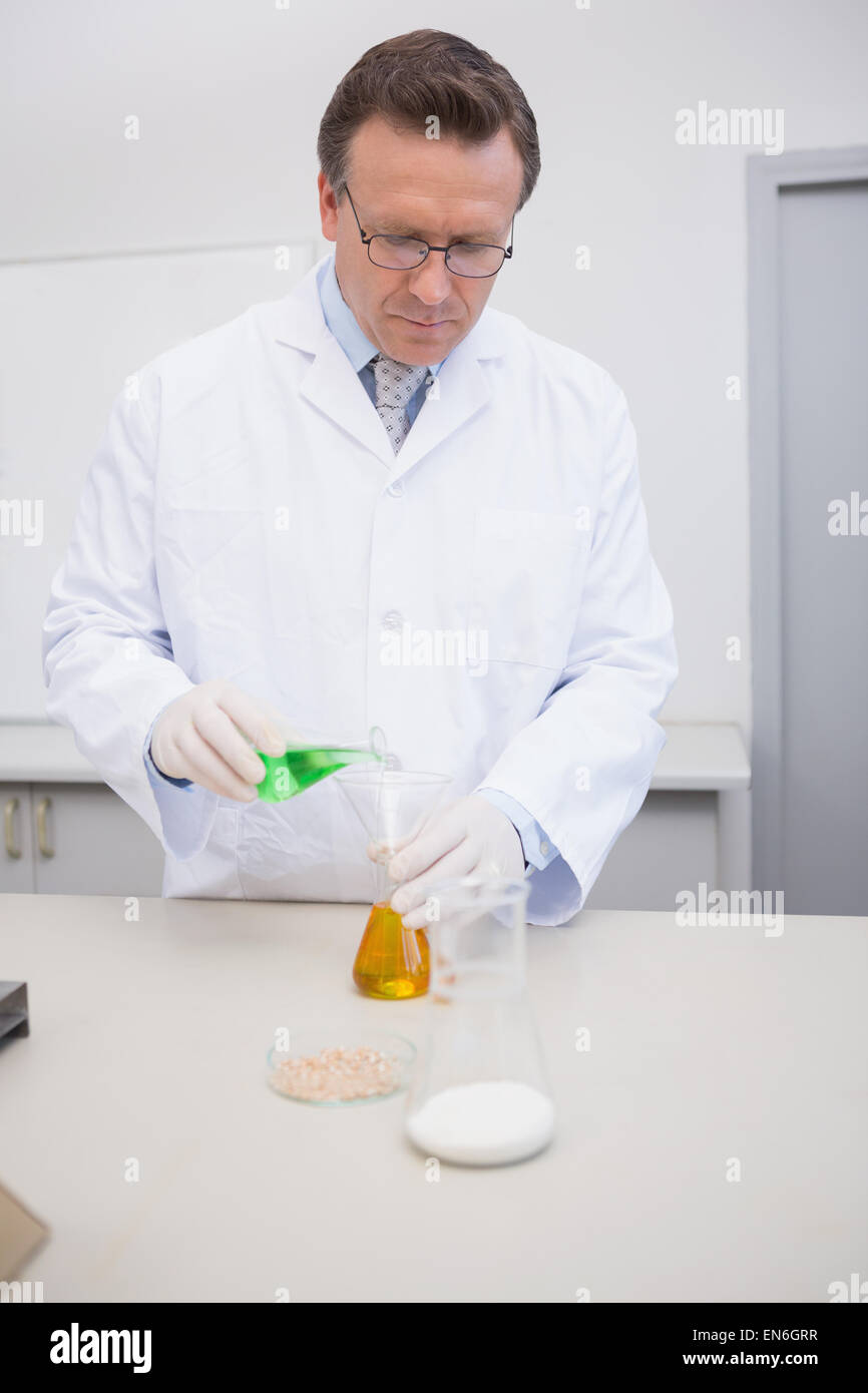 Scientist mixing precipitates Stock Photo - Alamy