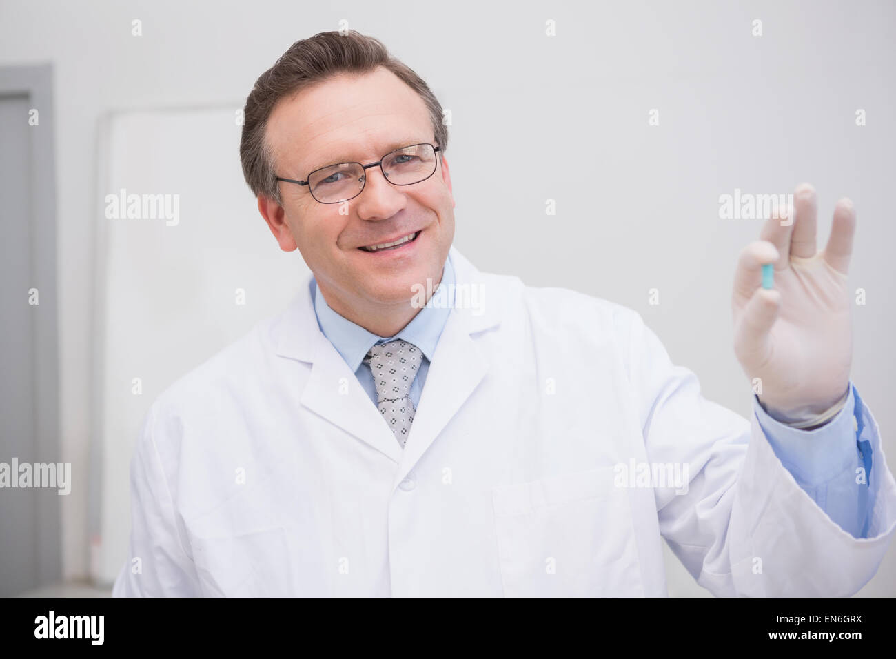 Scientist holding tablet Stock Photo - Alamy