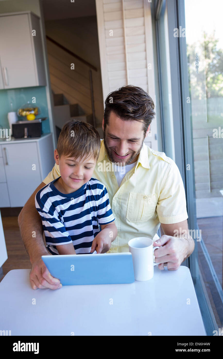 Father son using tablet pc hi-res stock photography and images - Alamy