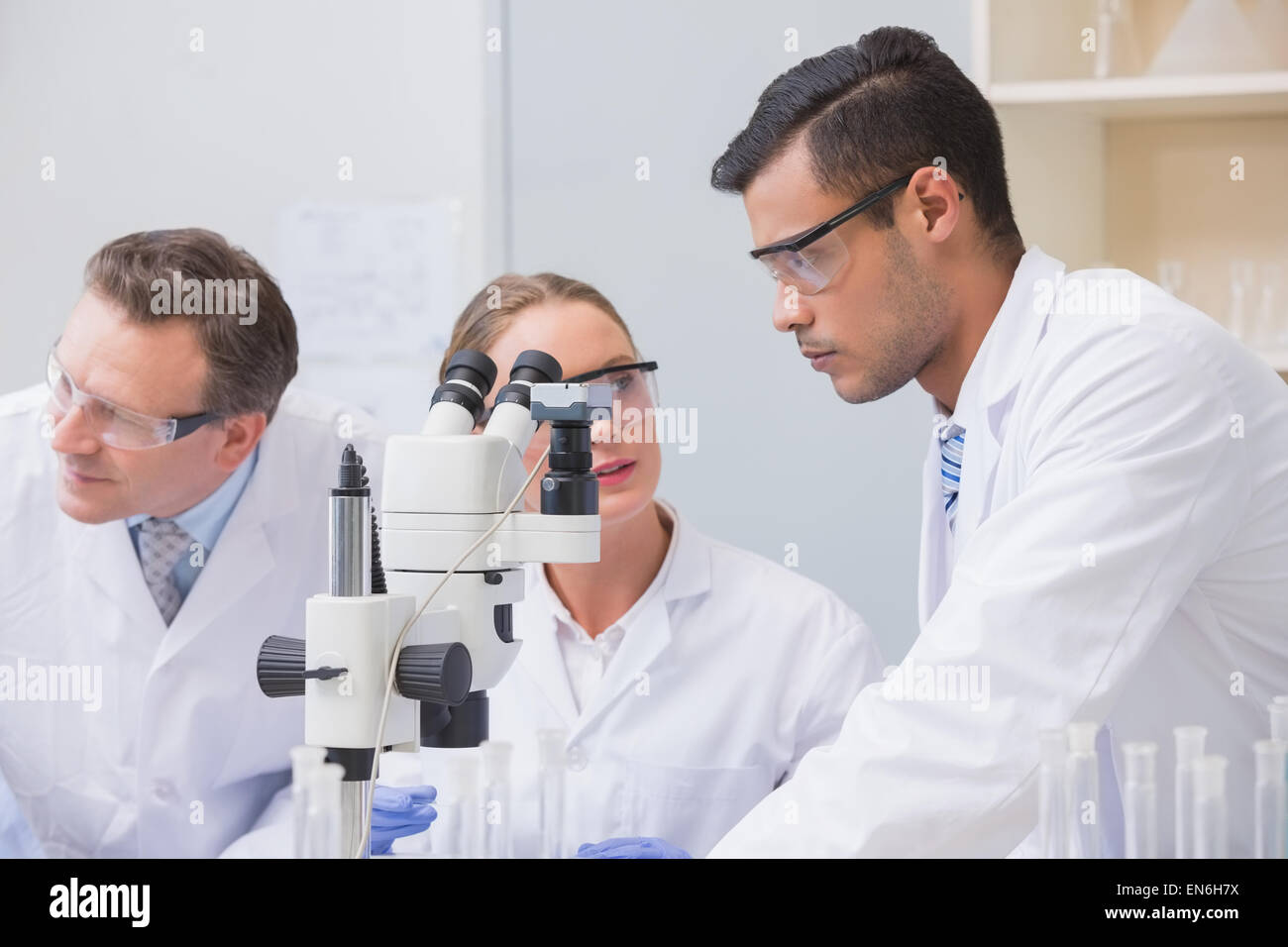 Scientists talking together Stock Photo - Alamy