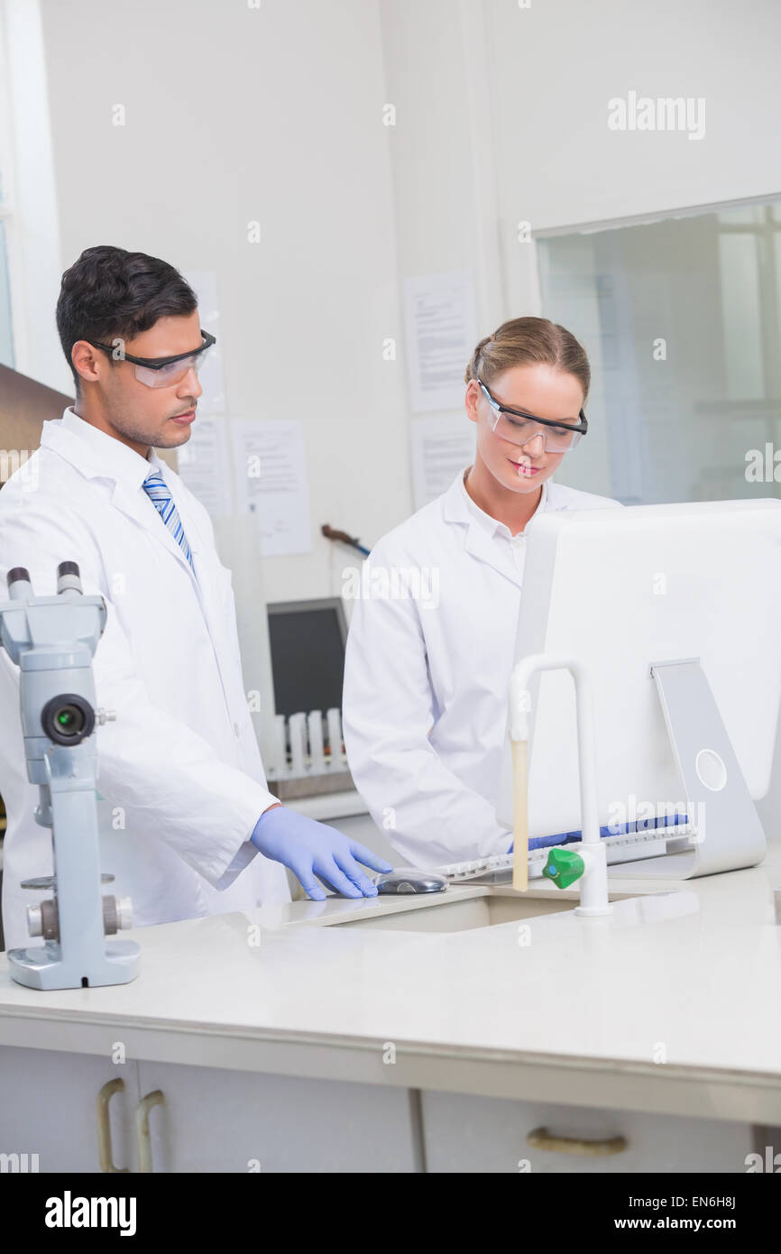 Scientist man typing on computer hi-res stock photography and images ...