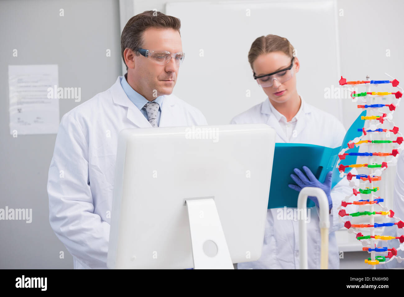 Scientists working together Stock Photo - Alamy