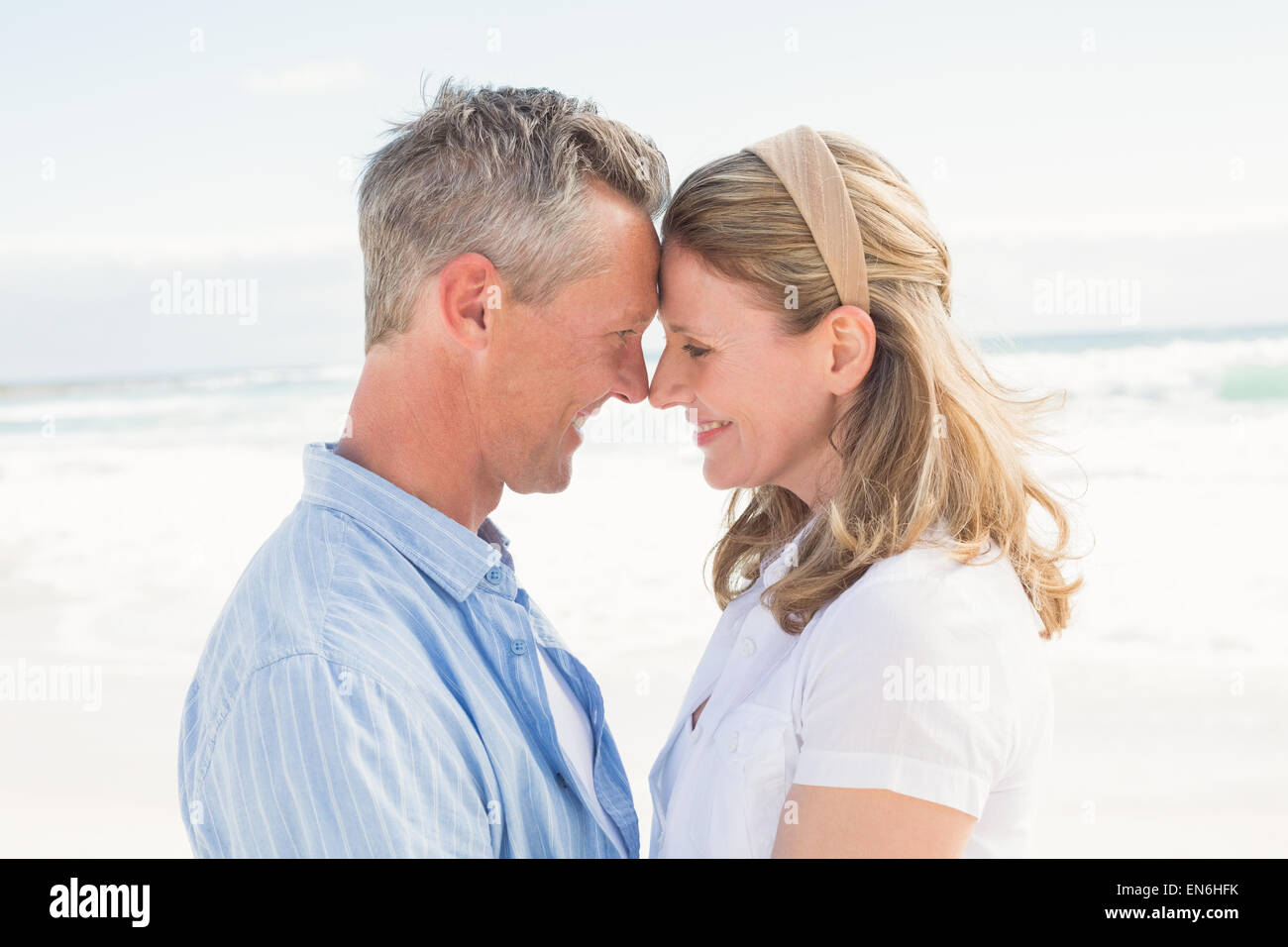 Happy couple smiling at each other Stock Photo - Alamy