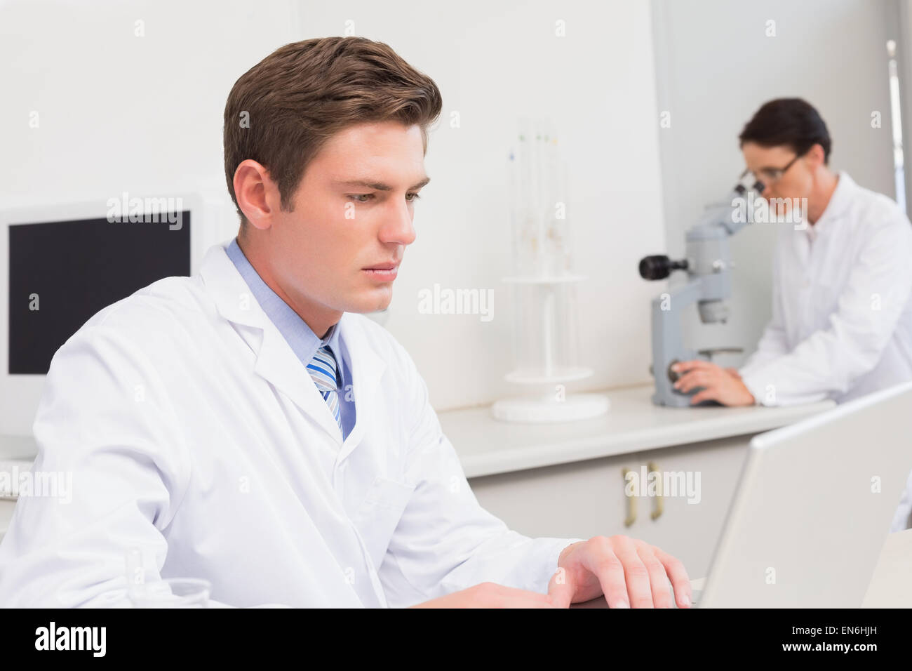 Woman scientist research laptop hi-res stock photography and images - Alamy