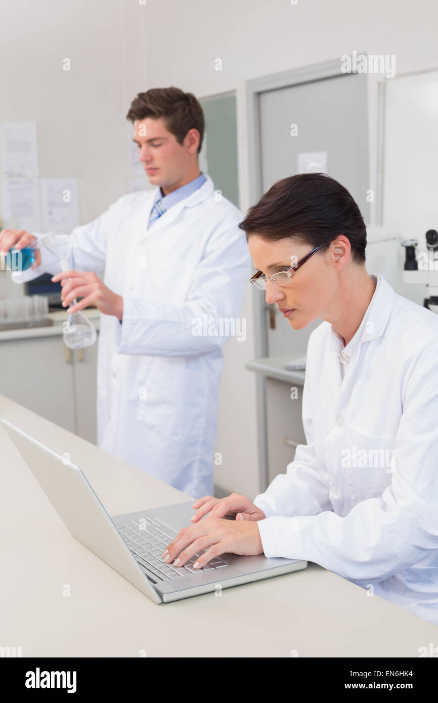 Scientist computer beaker hi-res stock photography and images - Alamy