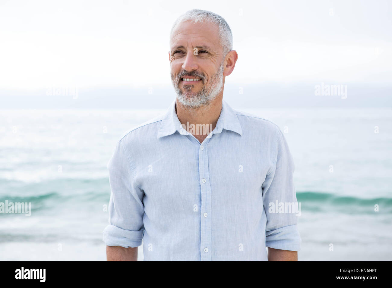 Man standing by the sea hi-res stock photography and images - Alamy