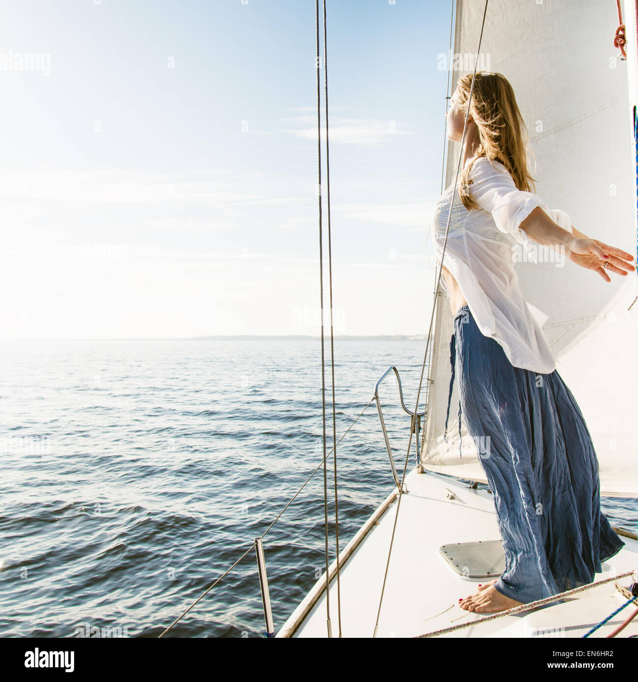 woman staying on sailboat Stock Photo - Alamy