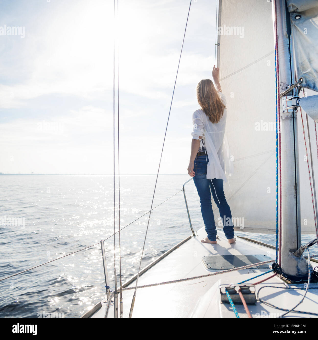 woman staying on sailboat Stock Photo - Alamy