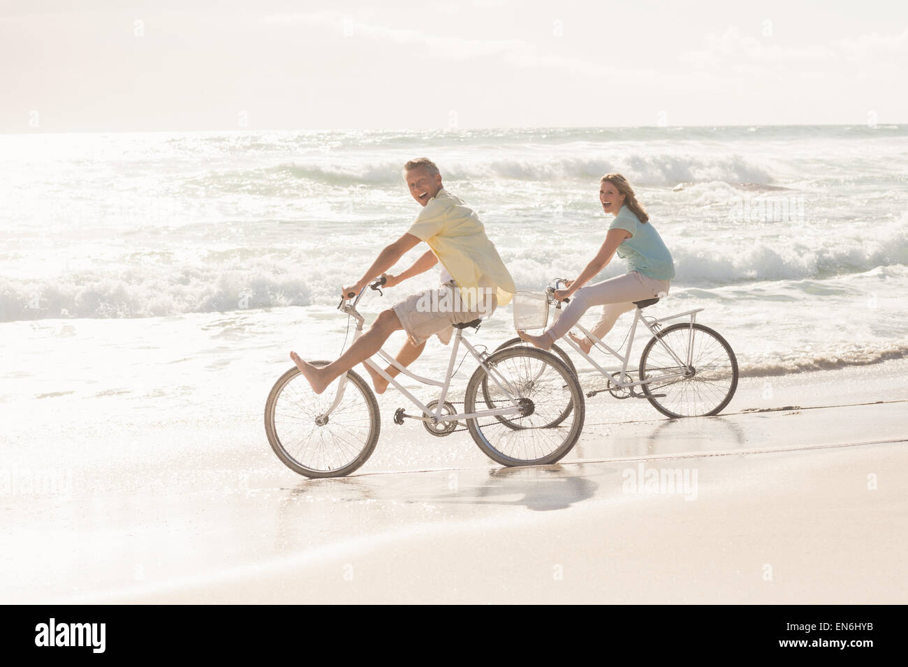 Happy couple on a bike ride Stock Photo - Alamy