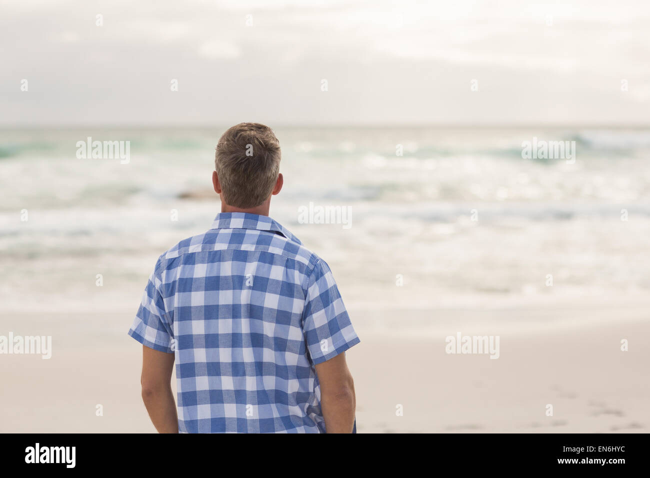 Man looking out to sea hi-res stock photography and images - Alamy