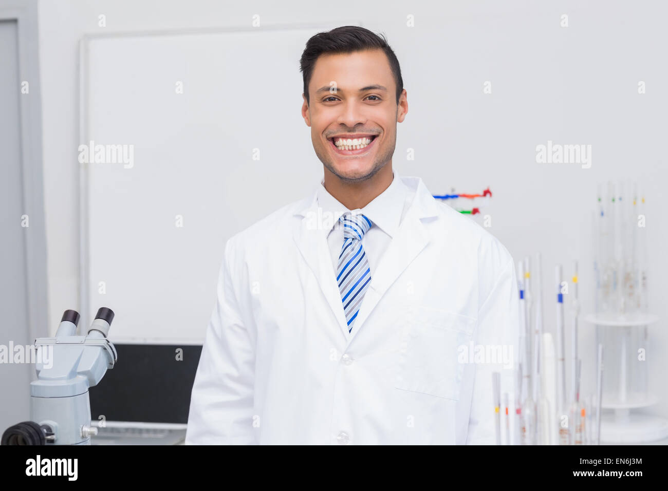 Happy scientist smiling at camera Stock Photo - Alamy
