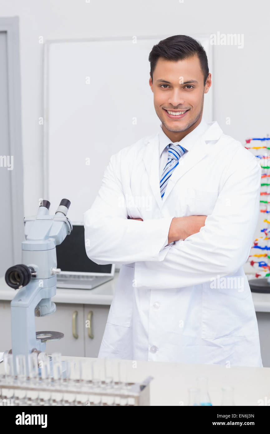 Happy scientist smiling at camera with arms crossed Stock Photo - Alamy